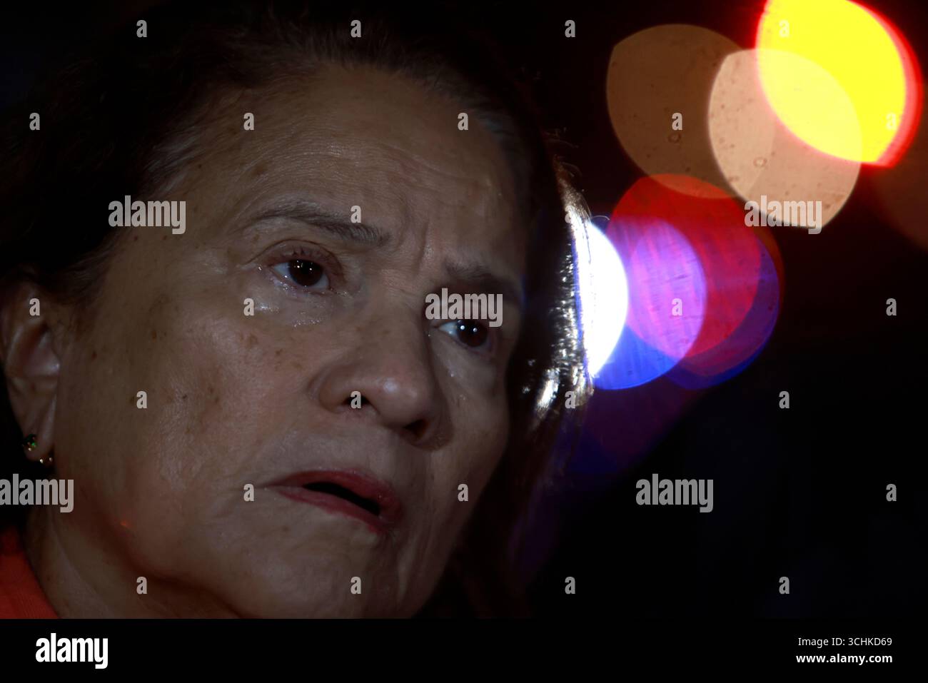 A supporter of former President Jair Bolsonaro prays near the ...