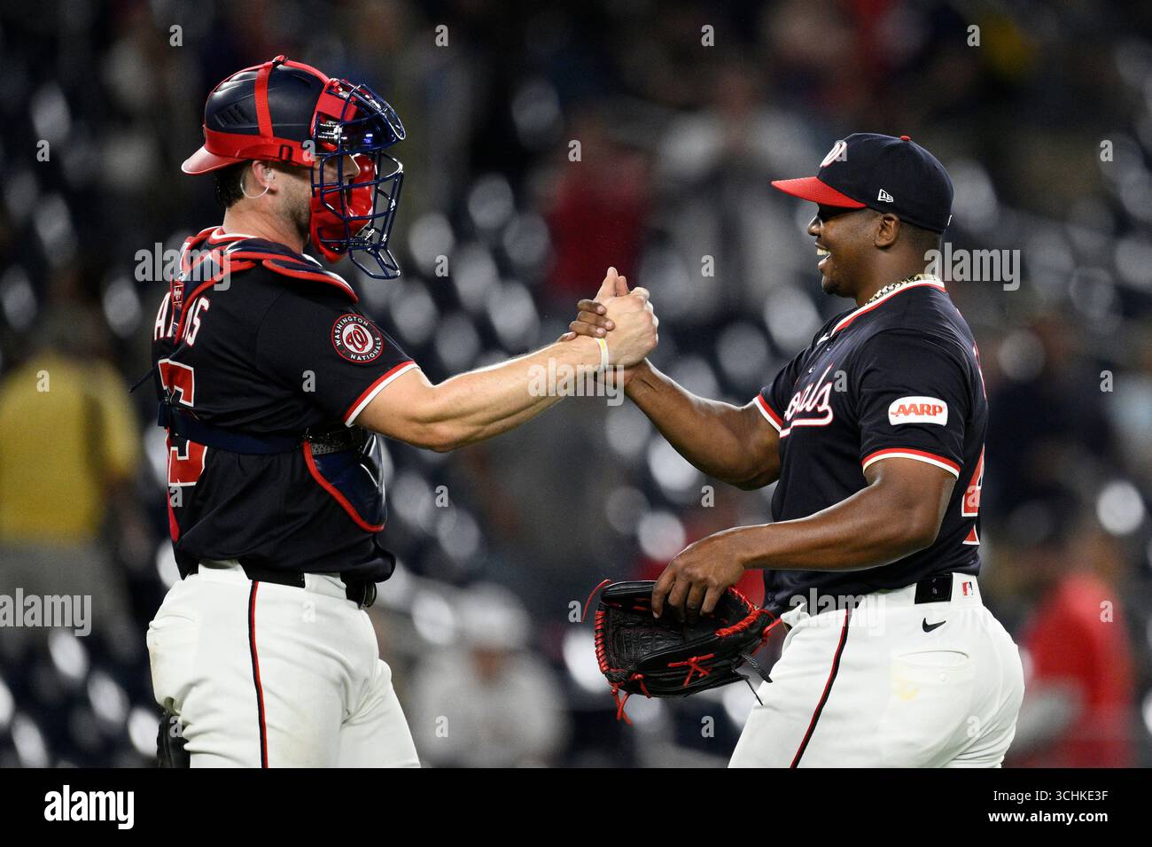 Washington Nationals relief pitcher Jose Ferrer, right, and catcher ...