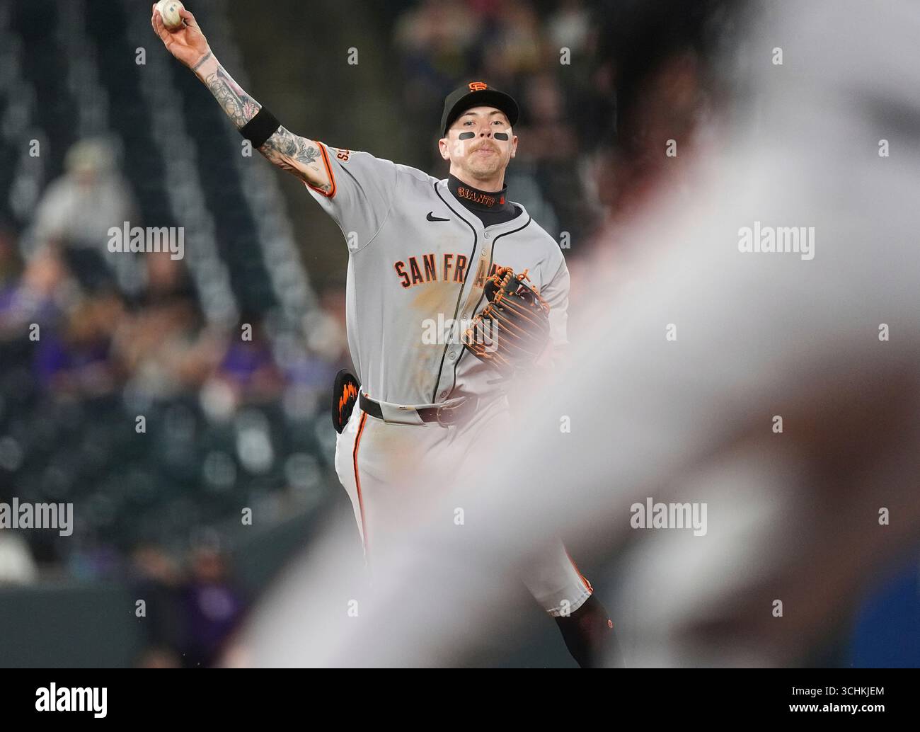 San Francisco Giants shortstop Christian Koss throws to first base to ...