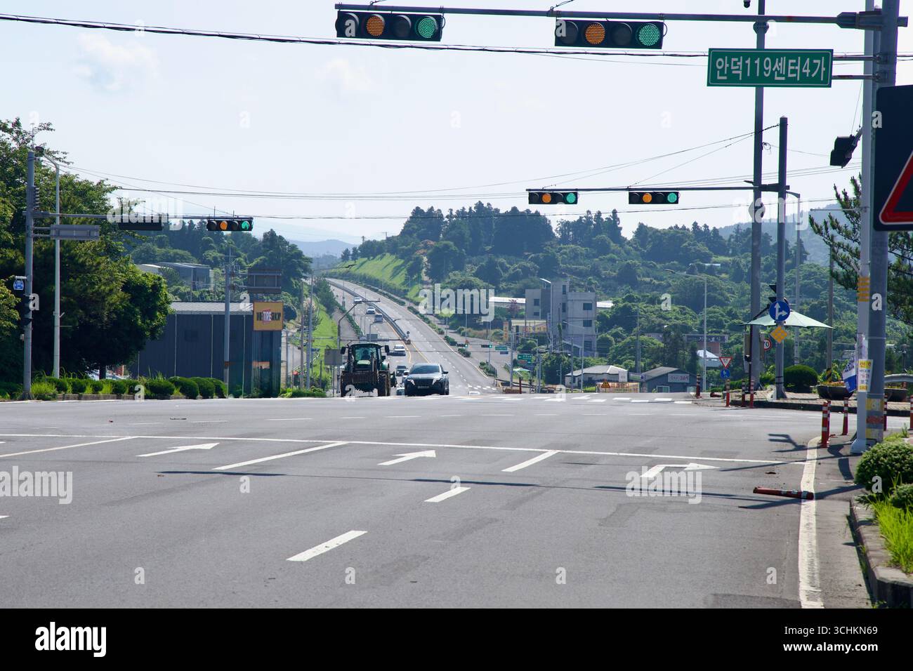 Traffic pauses at a broad Iljuseo Road intersection in Andeok‑eup, with ...