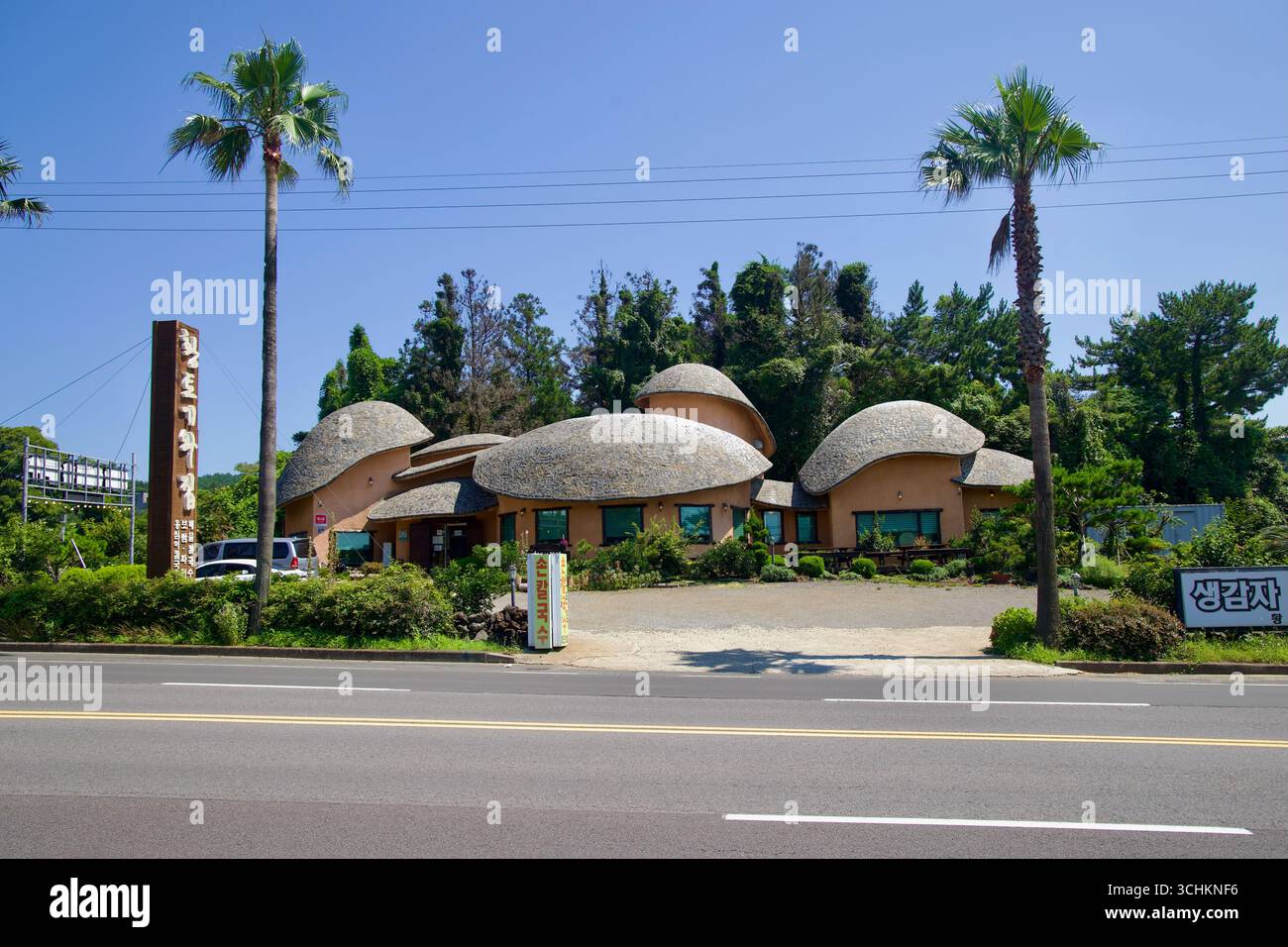 A roadside restaurant with distinctive dome-shaped roofs sits under ...