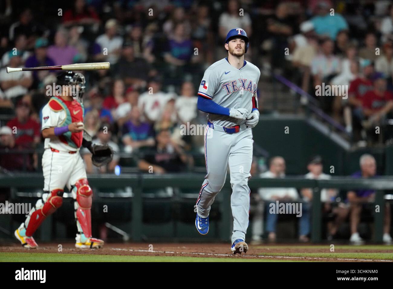 Texas Rangers' Jonah Heim tosses his bat away after earning a walk ...