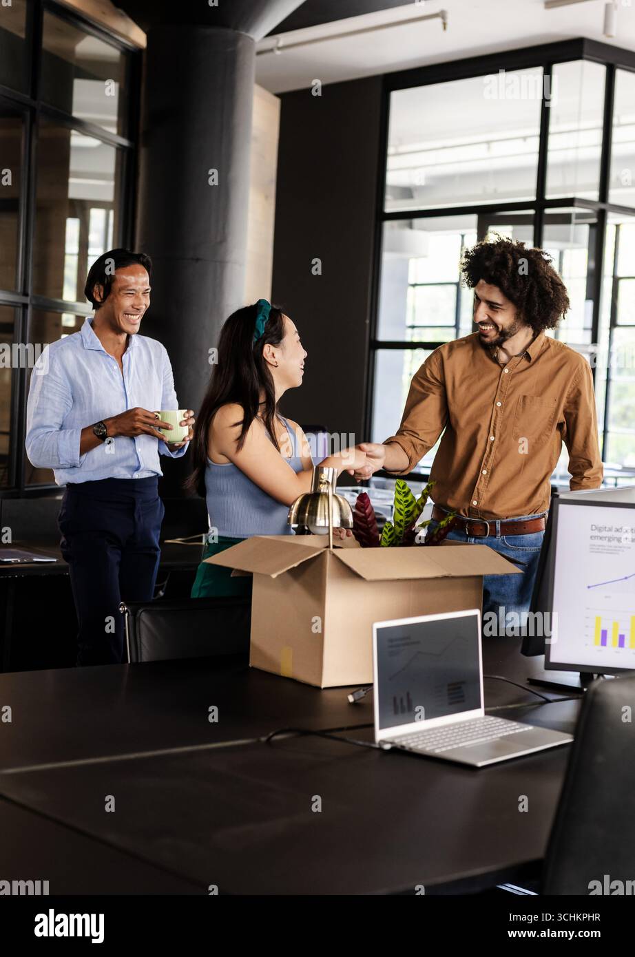Diverse colleagues celebrating new job hi-res stock photography and ...