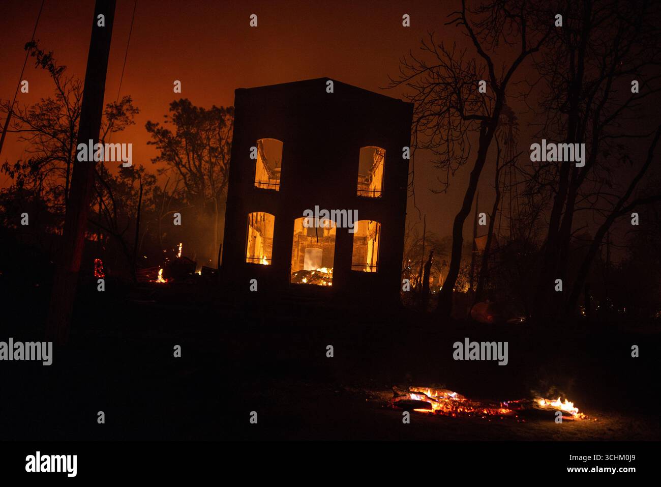 A structure is seen engulfed in flames during the 6-5 Fire in Chinese ...
