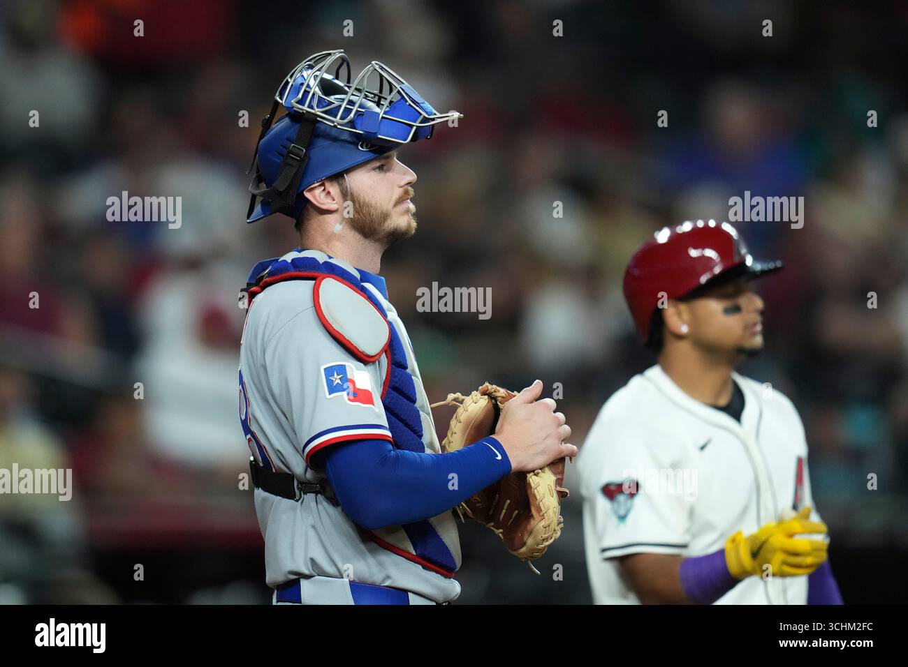 Texas Rangers catcher Jonah Heim pauses behind home plate during the ...