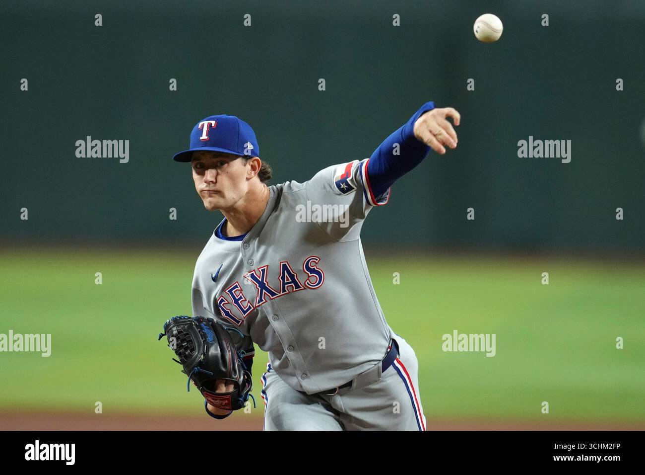 Texas Rangers starting pitcher Jacob Latz warms up during the first ...