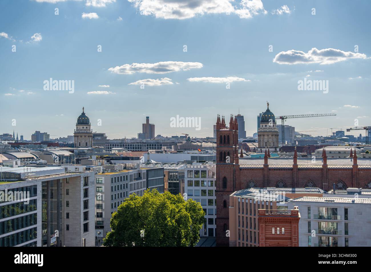 Rooftop view of Berlin with twin church domes and red brick ...