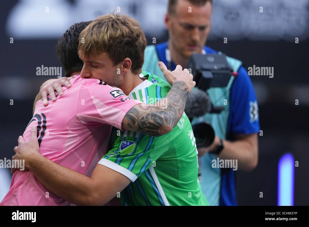 Inter Miami forward Lionel Messi, left, greets Seattle Sounders forward ...