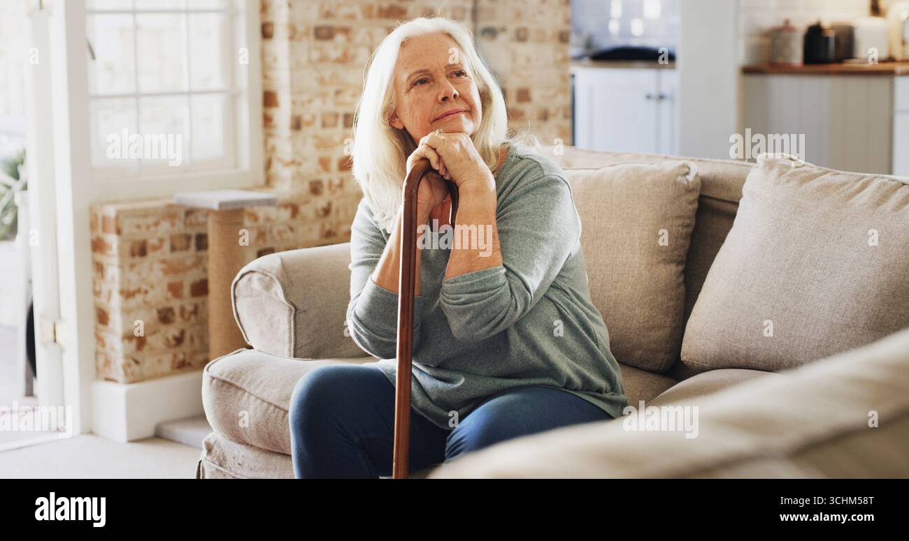 Thinking, relax and old woman in home with walking stick, pensioner and ...