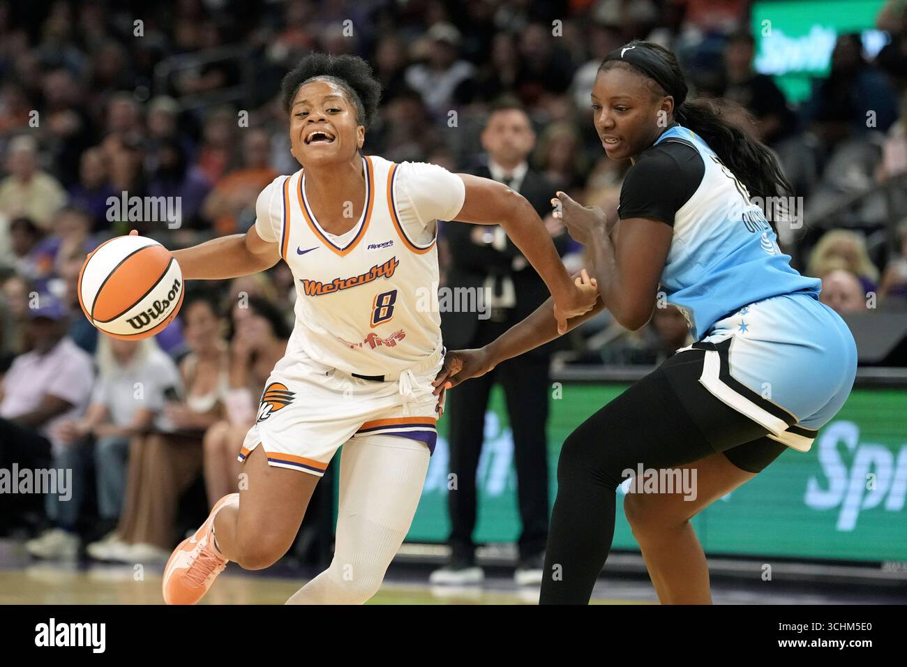 Phoenix Mercury guard Monique Akoa Makani (8) drives past Chicago Sky forward Michaela Onyenwere ...
