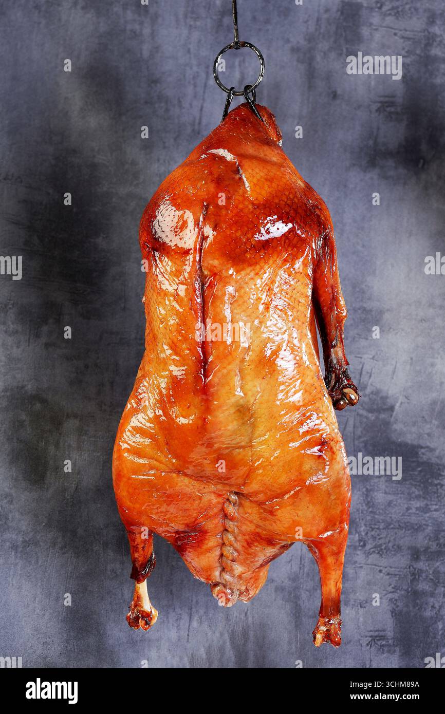 Hanging Cantonese Deep-Well Roast Goose Stock Photo - Alamy