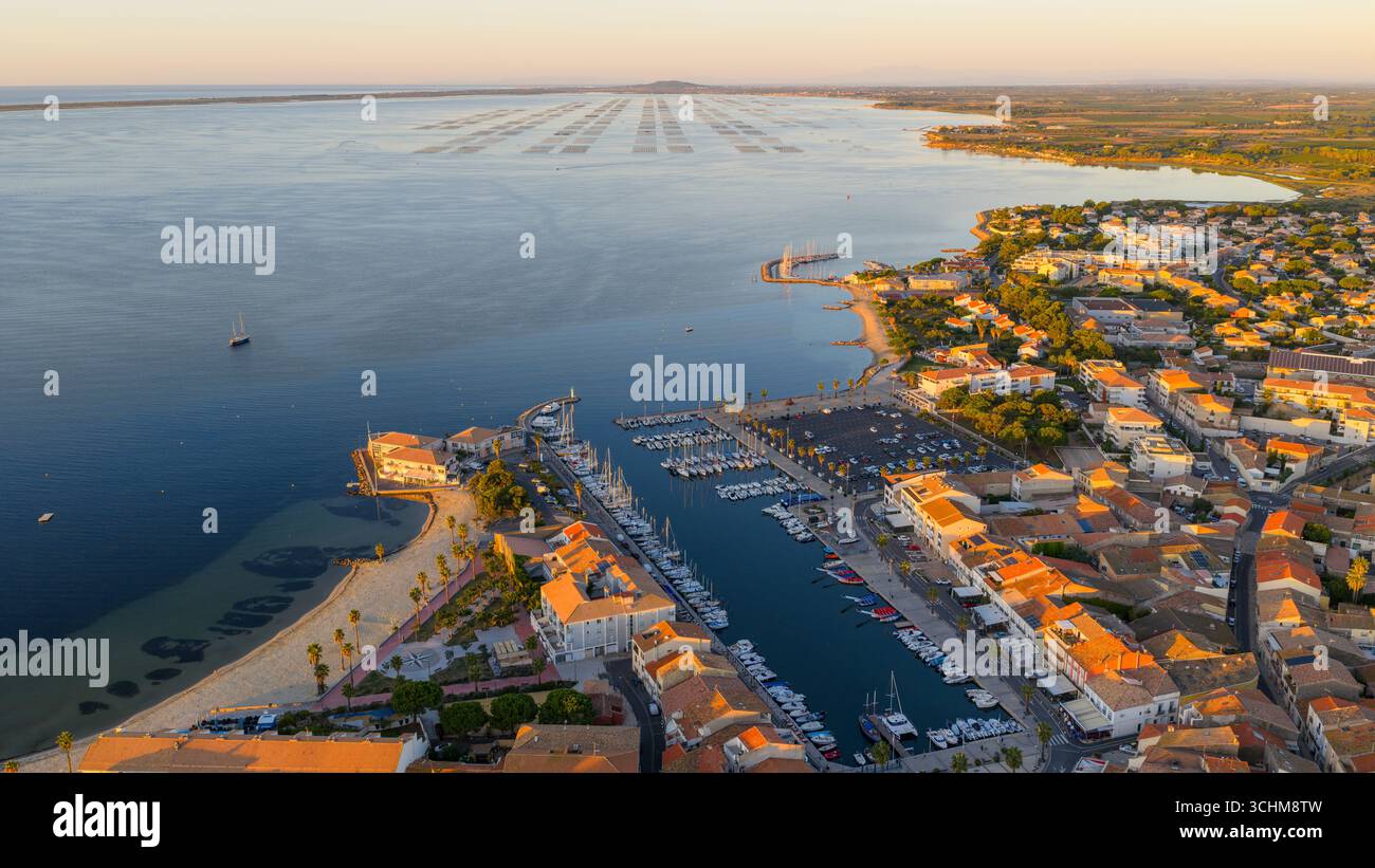 Aerial panorama of Meze at sunrise, in Occitanie, France Stock Photo ...