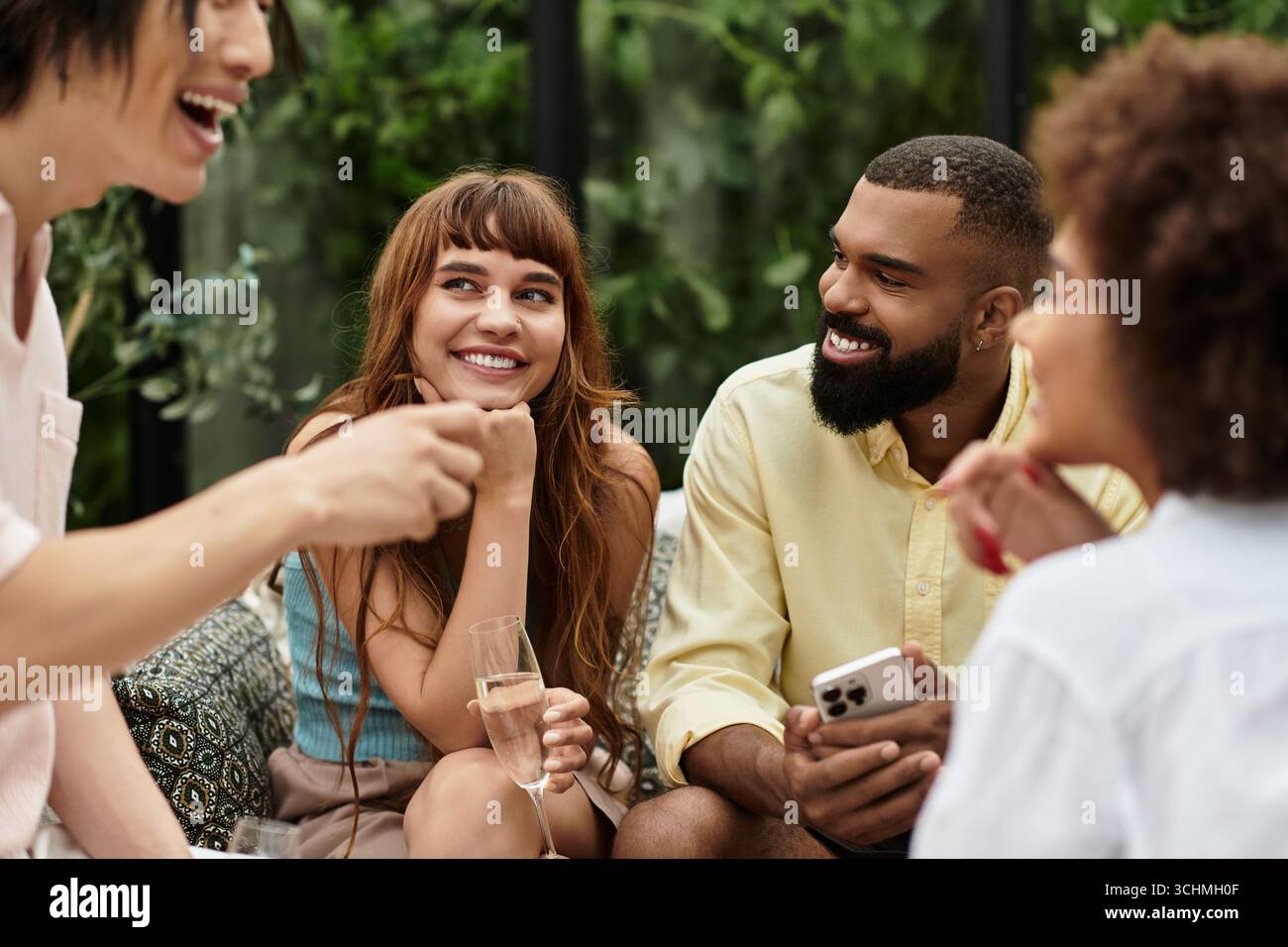 Friends are bonding over drinks at a vibrant outdoor cafe, sharing ...