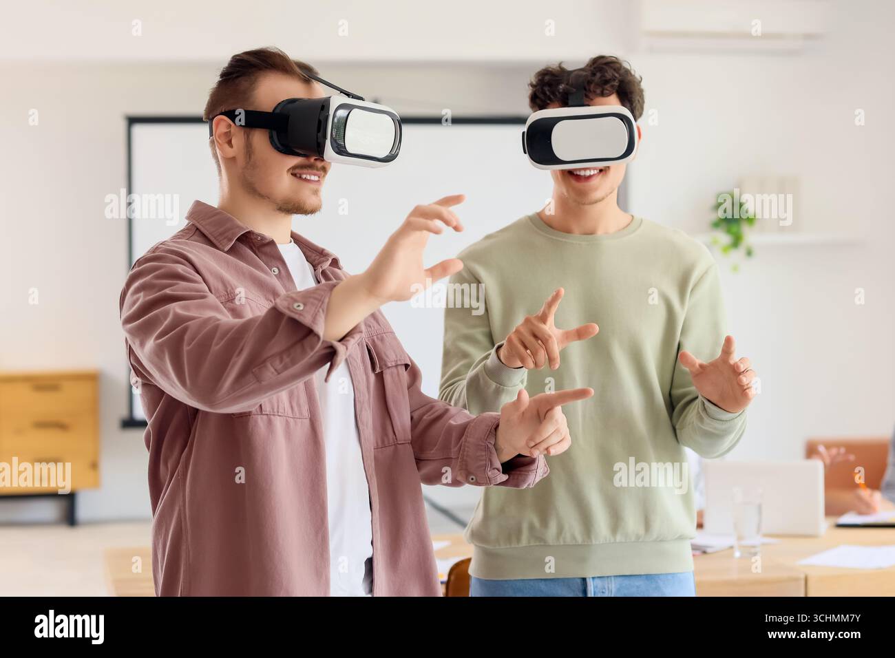 Young men using vr hi-res stock photography and images - Alamy
