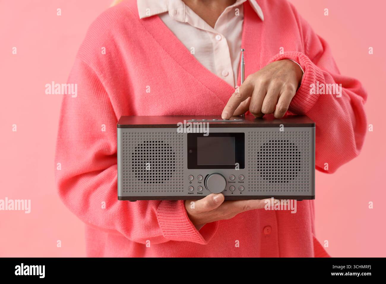 Senior woman turning radio hi-res stock photography and images - Alamy