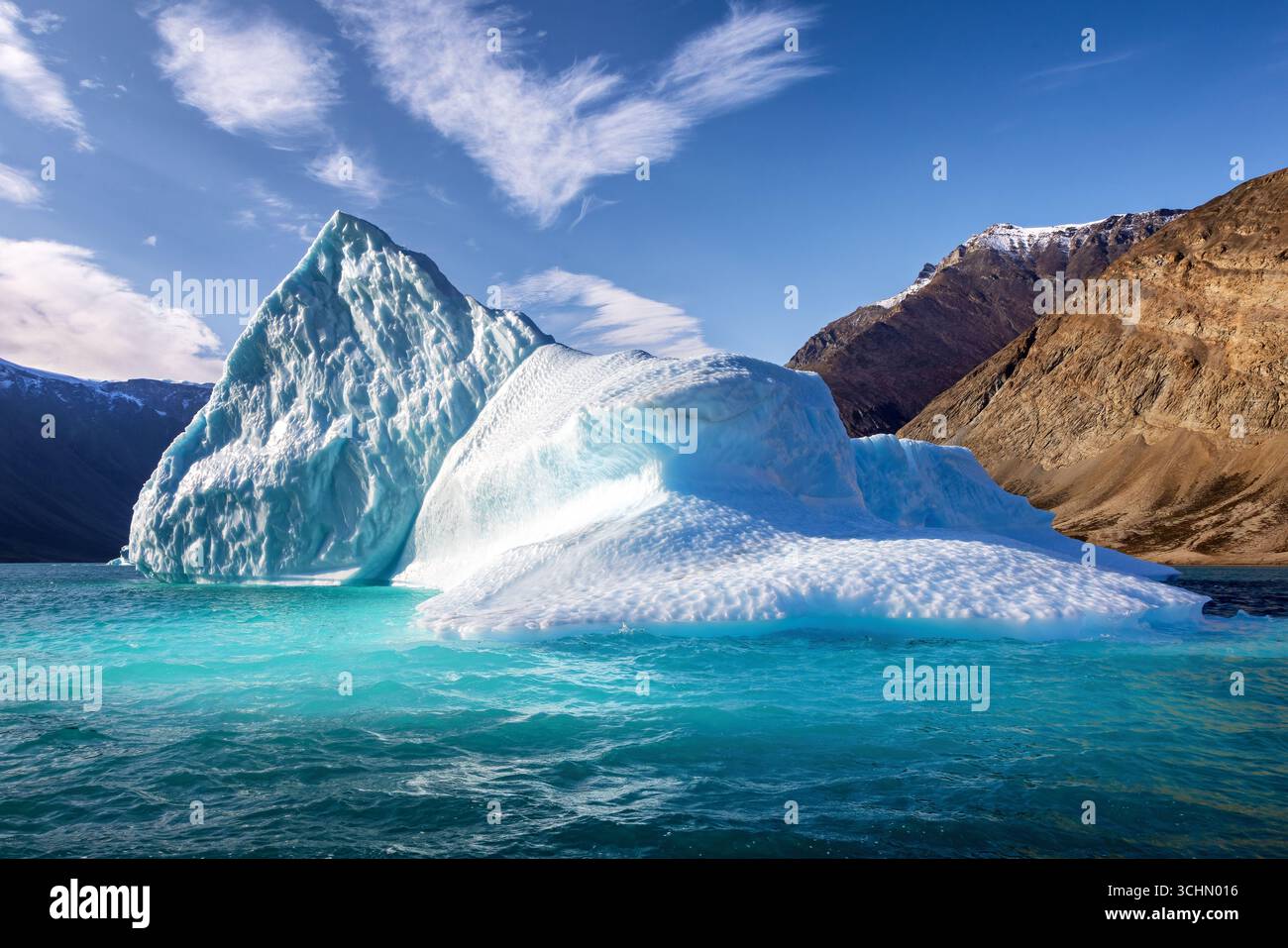 Giant blue iceberg in the turquoise waters of Kjerulf Fjord, Northeast ...