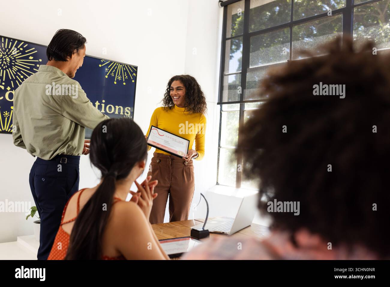 Receiving award in office, smiling woman with applauding diverse ...