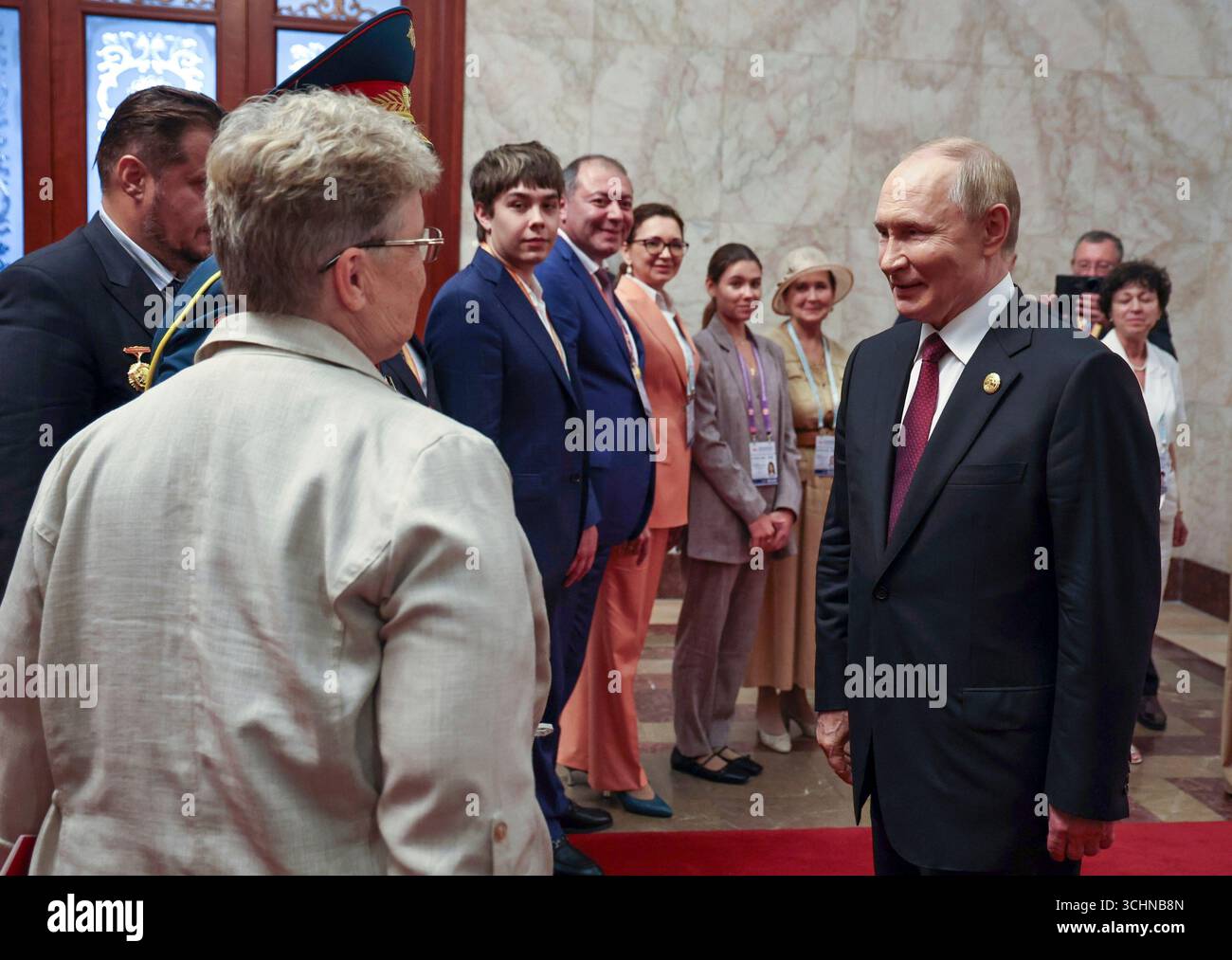 Russian President Vladimir Putin, right, meets with descendants of ...