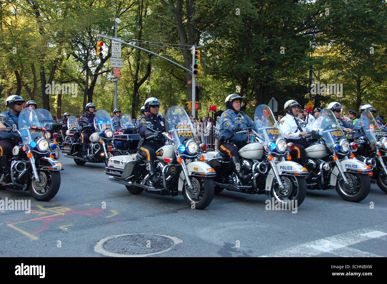 NYPD motorcycle police officers riding in formation during the Columbus ...