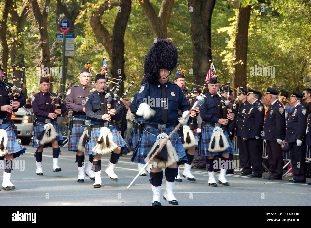 NYPD pipe and drum band in kilts playing bagpipes during the Columbus ...