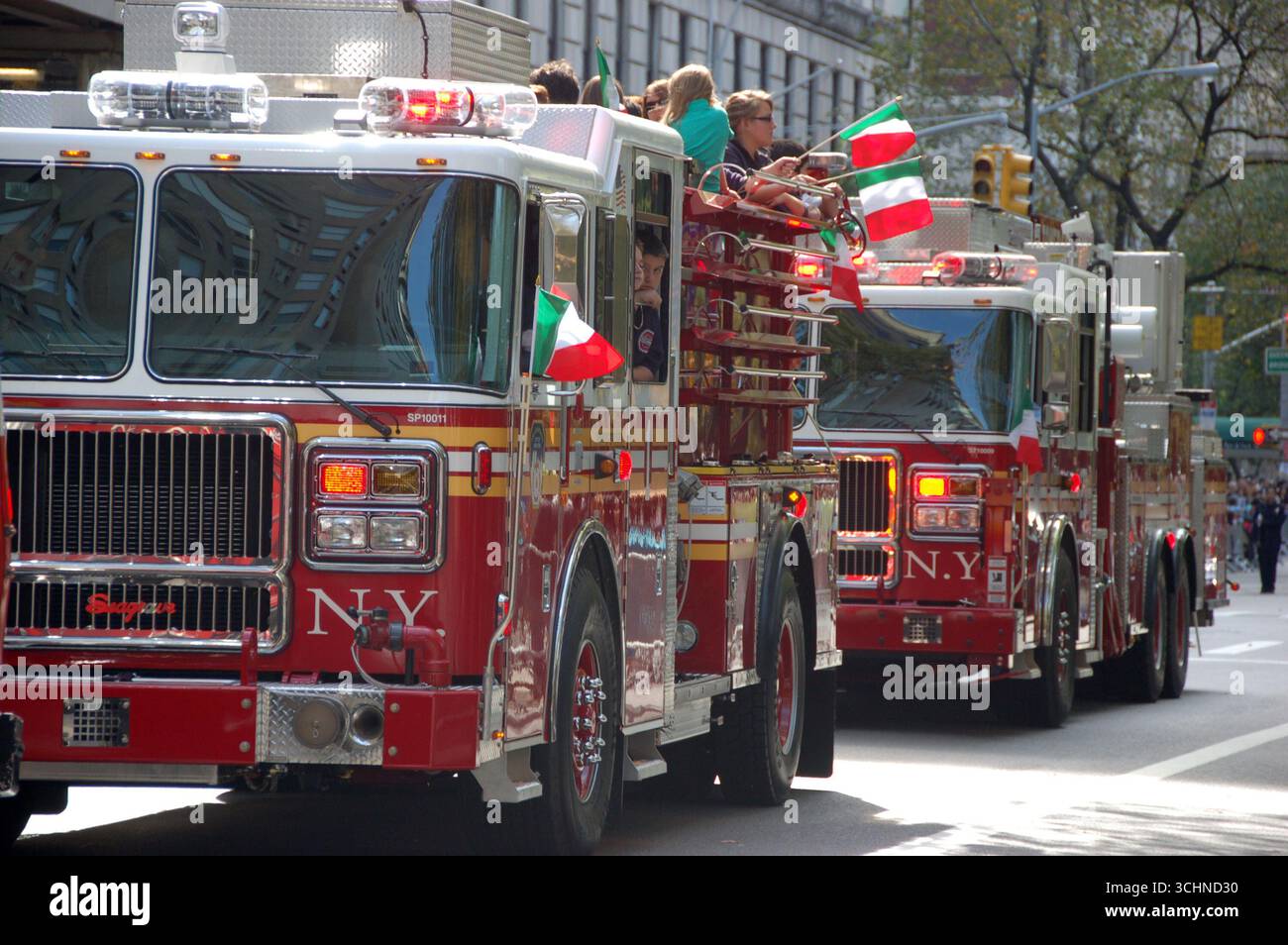 FDNY fire truck Tower Ladder 23 drives along a New York City street ...