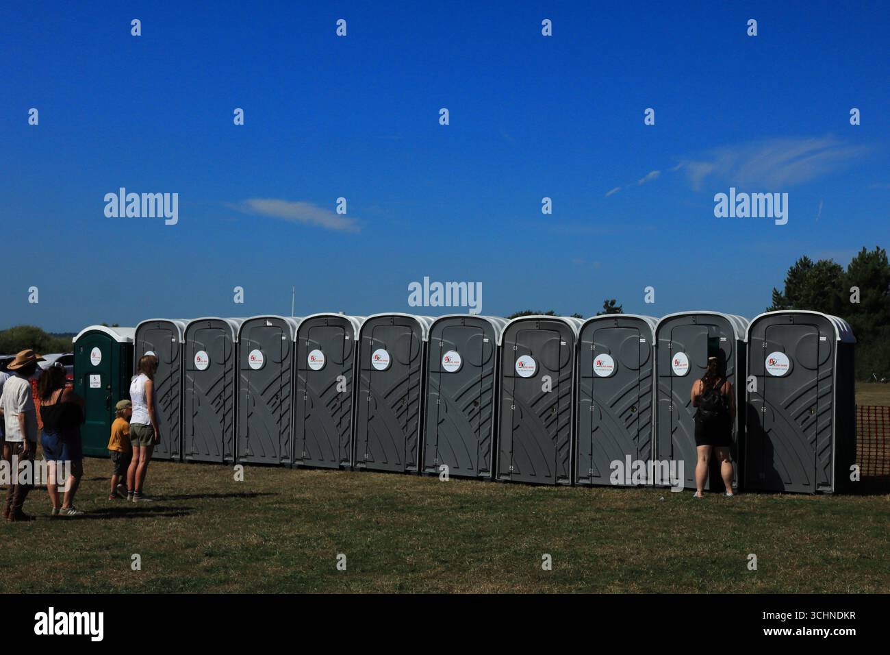 Portable toilets on grass hi-res stock photography and images - Alamy