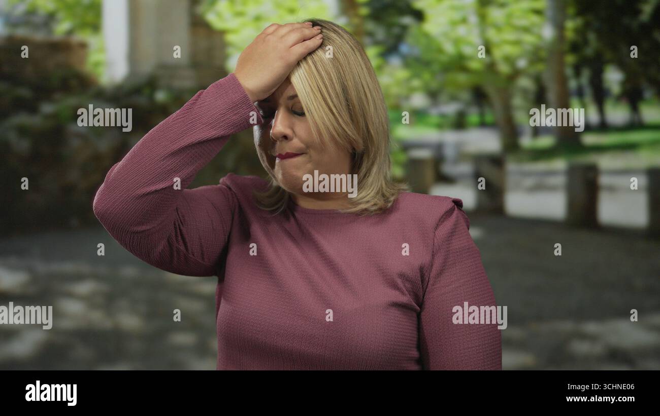 Woman touches forehead stone bench hi-res stock photography and images ...