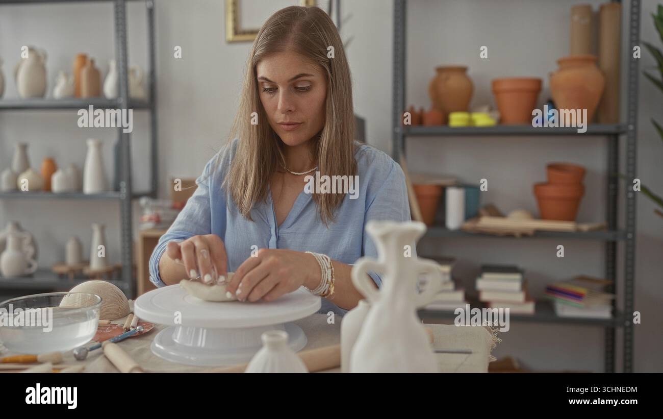 Female ceramist carefully shaping ceramic hi-res stock photography and ...