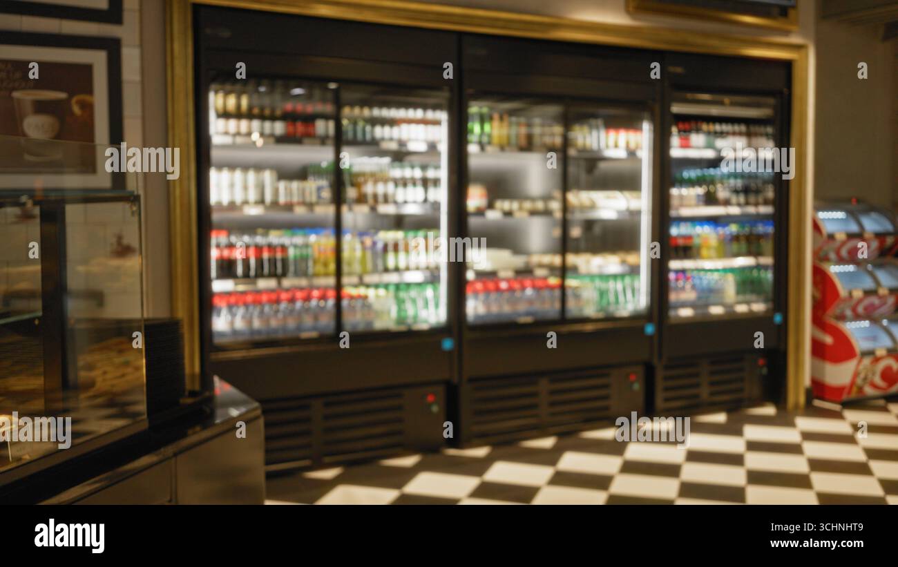 Blurry grocery store interior with beverage fridges and soft lighting creating a defocused bokeh ...
