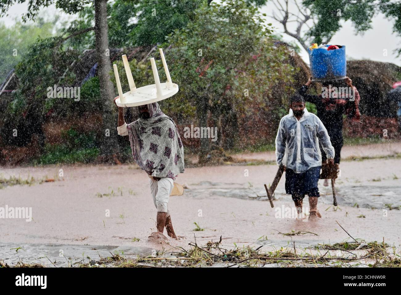 Residents evacuate their homes and move to safer areas after the River ...