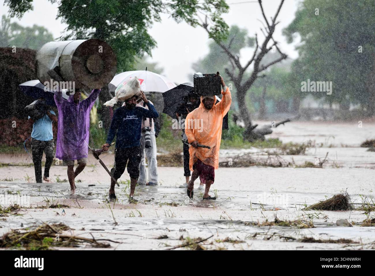 Residents evacuate their homes and move to safer areas after the River ...
