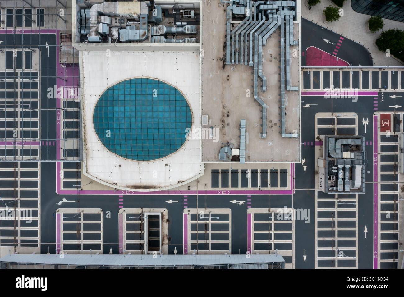 Top-down view of modern building rooftop with ventilation systems and ...