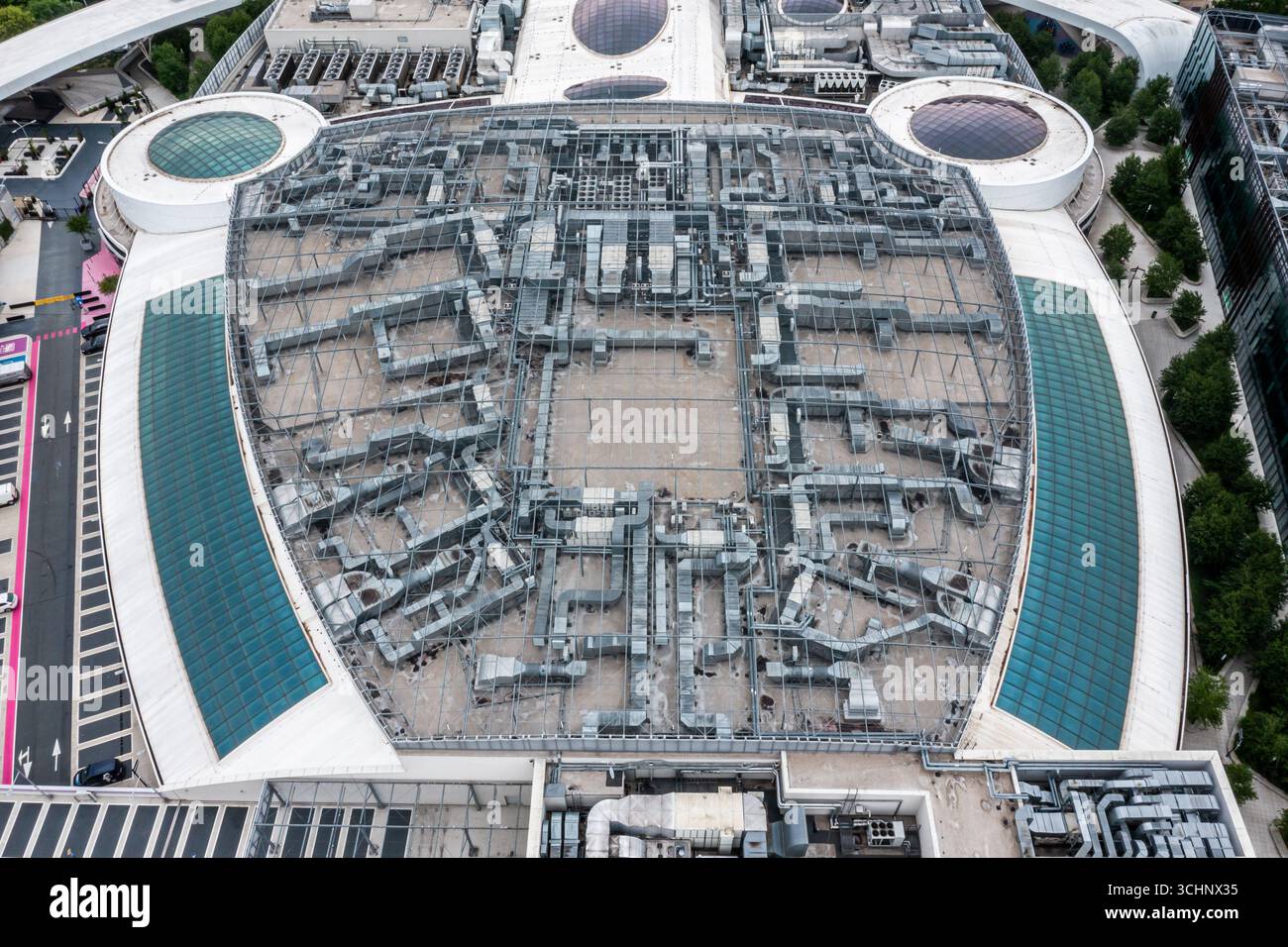 Top-down view of urban rooftop structure with visible HVAC ventilation ...