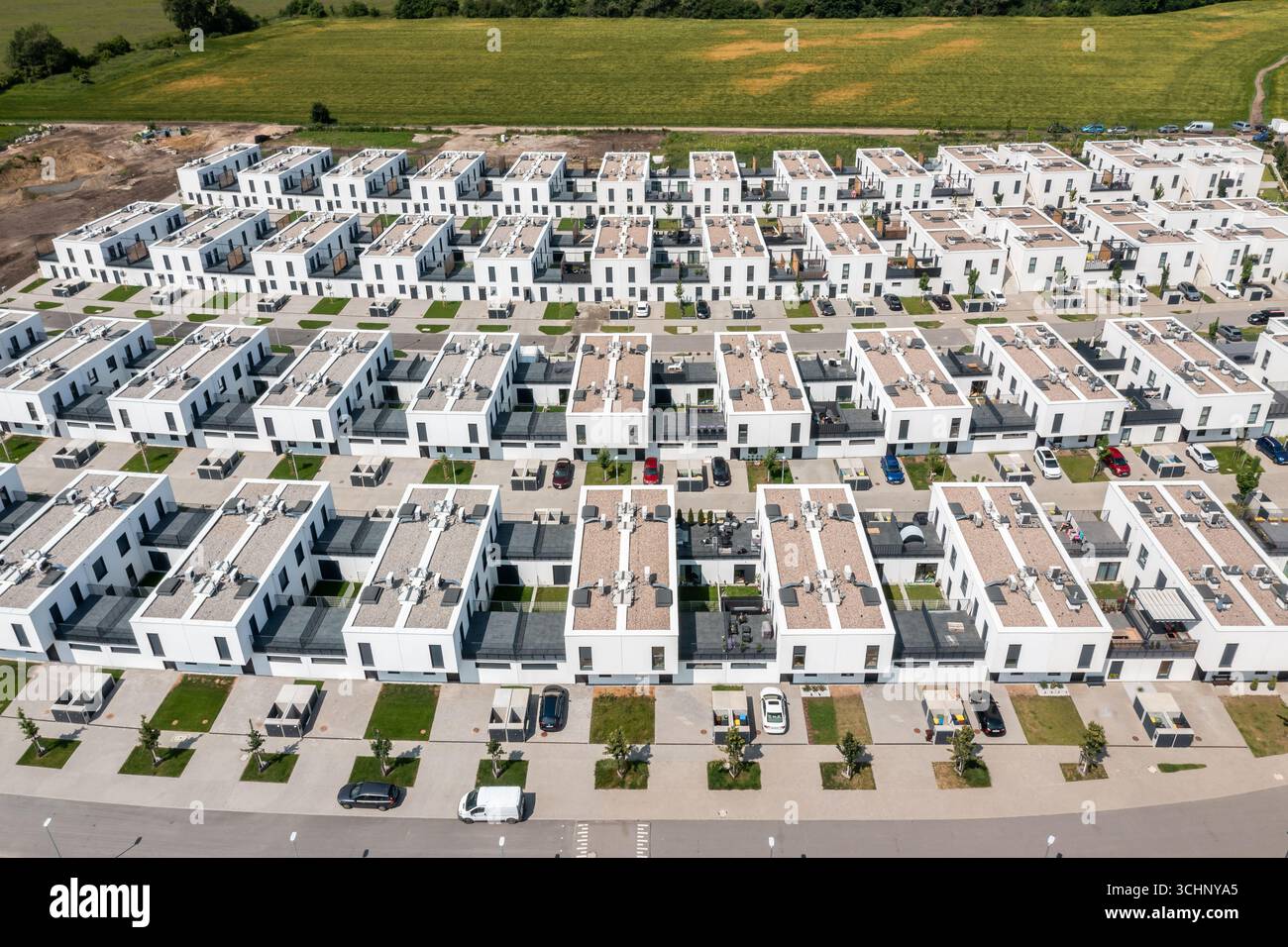 Top-down aerial view of suburban housing grid with identical two-story ...