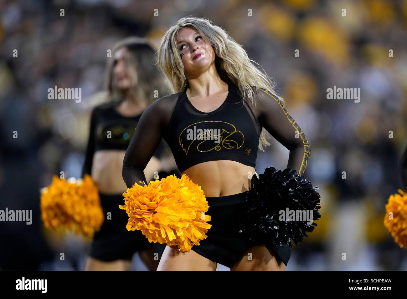 Iowa cheerleaders perform during the second half of an NCAA college ...