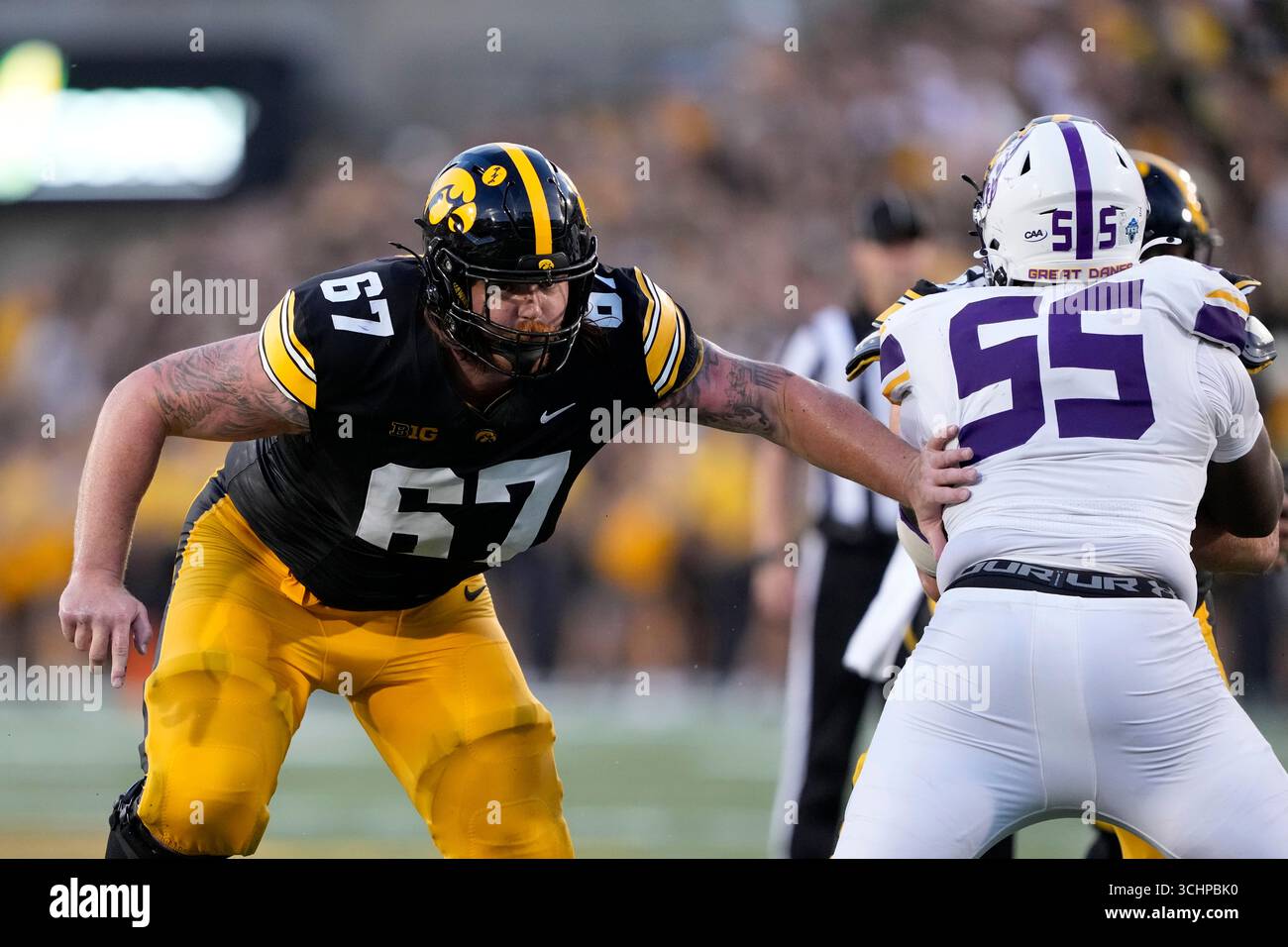 Iowa offensive lineman Gennings Dunker (67) looks to make a block ...