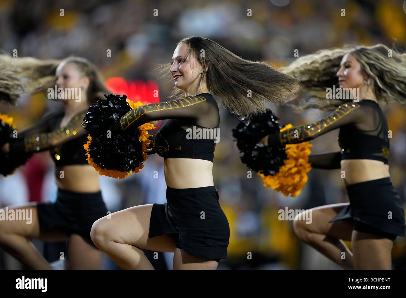 Iowa cheerleaders perform during the second half of an NCAA college ...