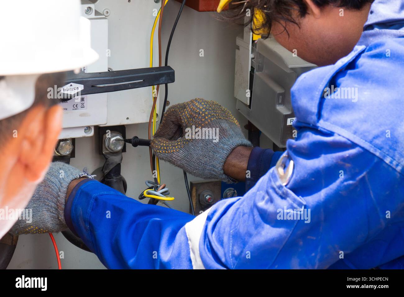 CANGGU, BALI - Oct 24: Electrical workers install a new substation ...