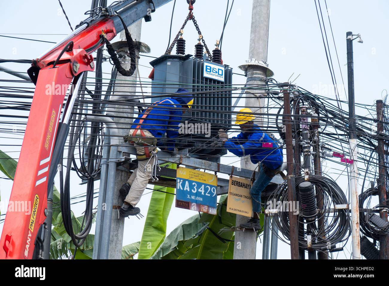 CANGGU, BALI - Oct 24: Electrical workers install a new substation ...