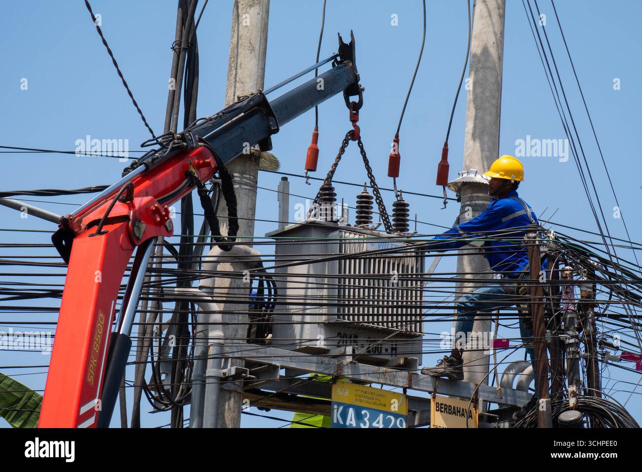 CANGGU, BALI - Oct 24: Electrical workers install a new substation ...