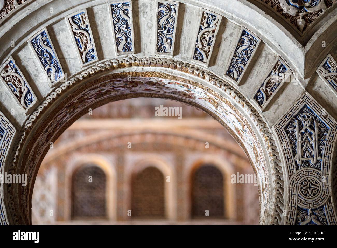 Lavish stucco arches adorned with intricate patterns create a stunning ...