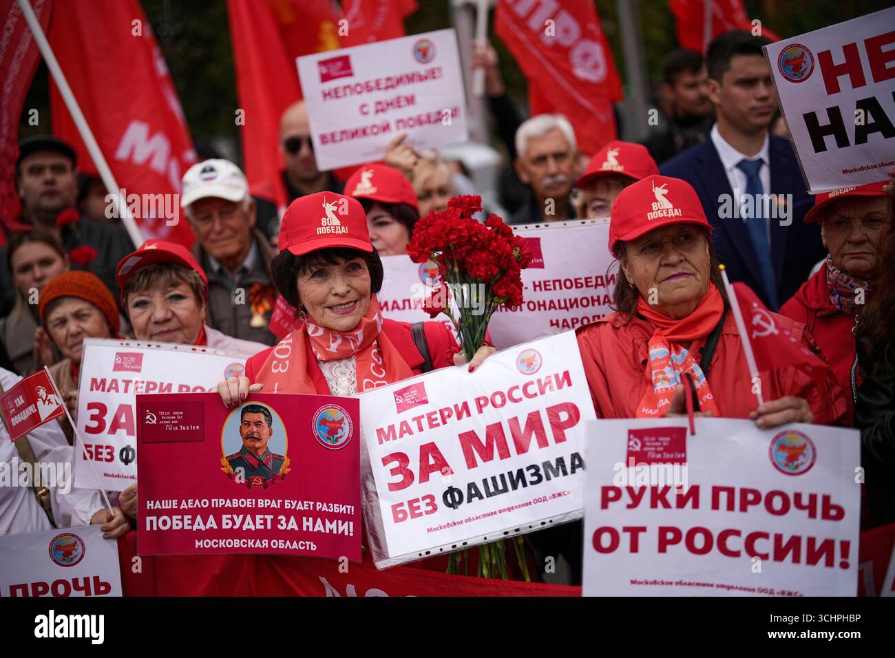 Russia communist's party supporters with posters reading "Hands off ...
