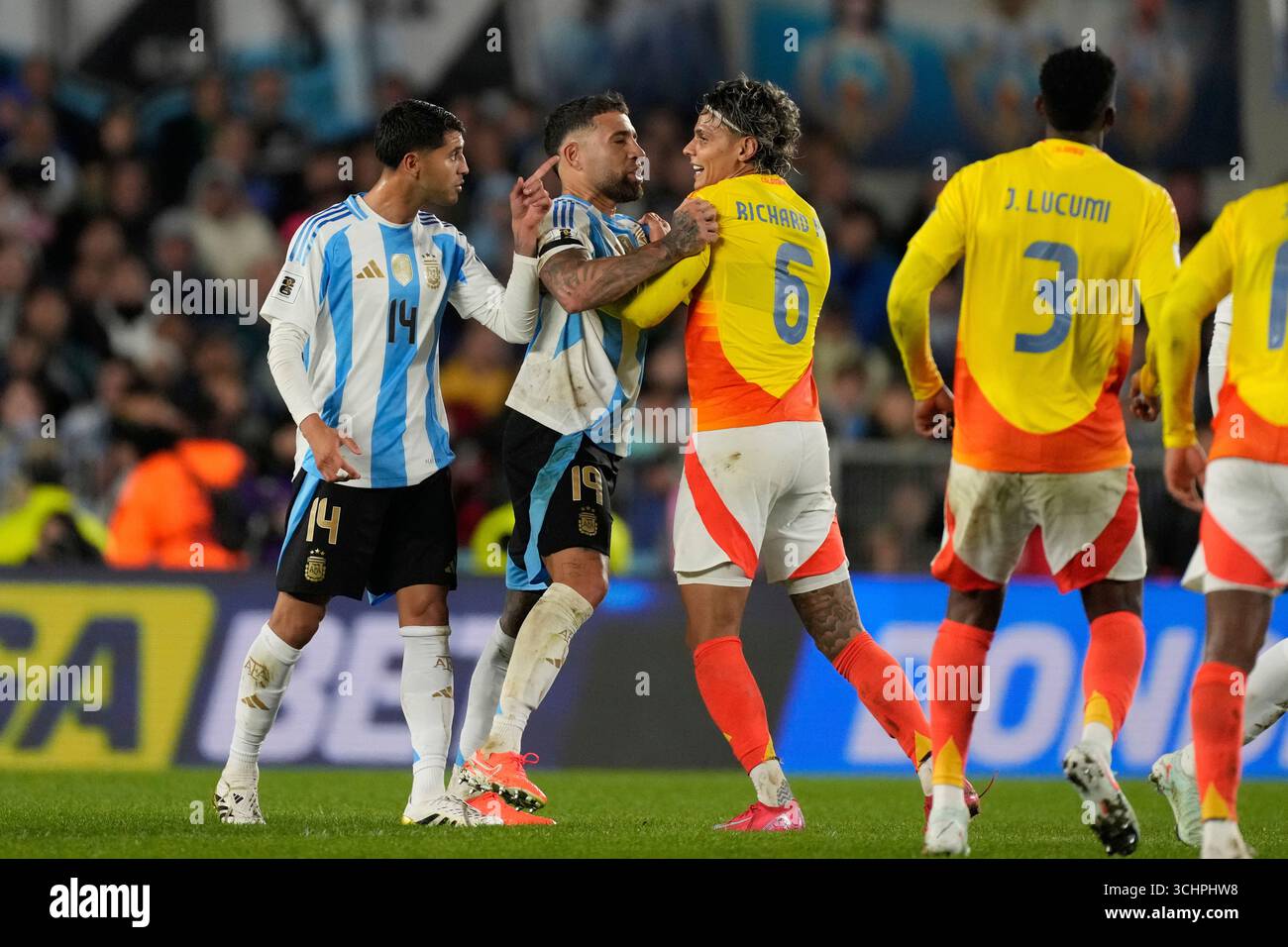 FILE - Colombia's Richard Rios (6) argues Argentina's Nicolas Otamendi ...