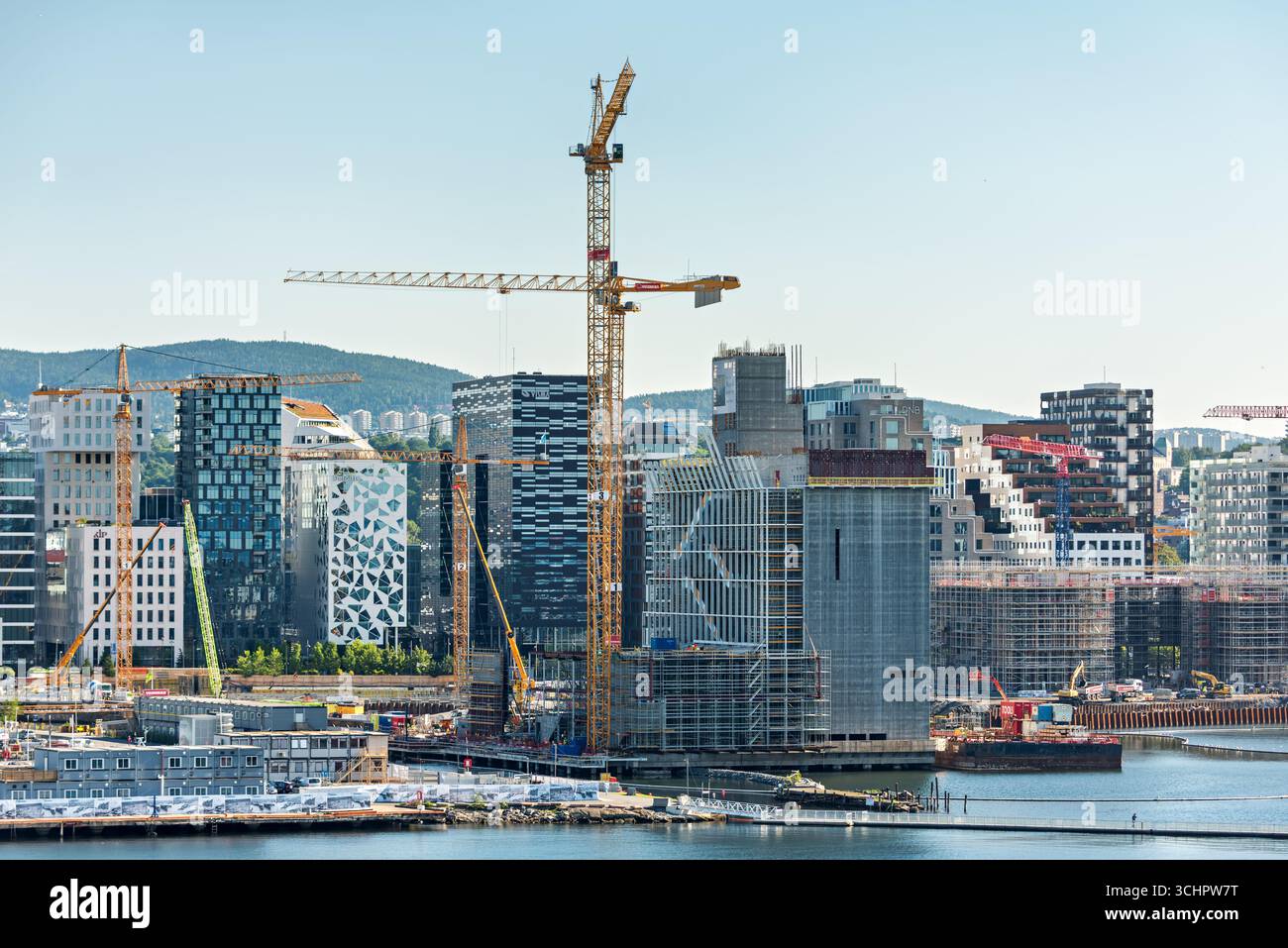 Construction Cranes Over Waterfront Buildings Oslo Norway // OSLO, Norway — Construction cranes ...