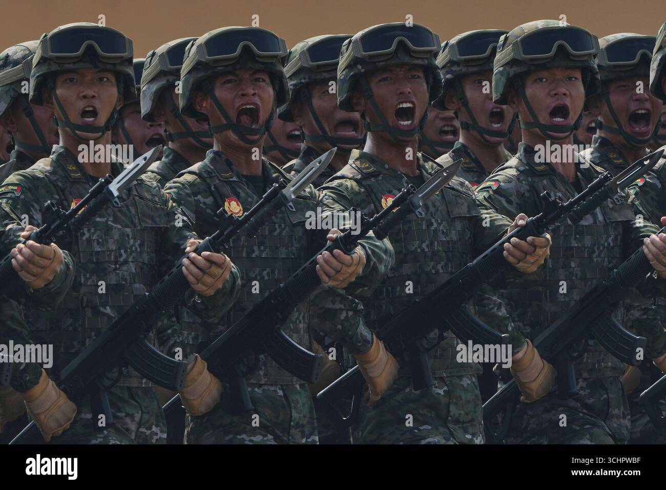 Military personnel shout as they take part in a military parade to ...