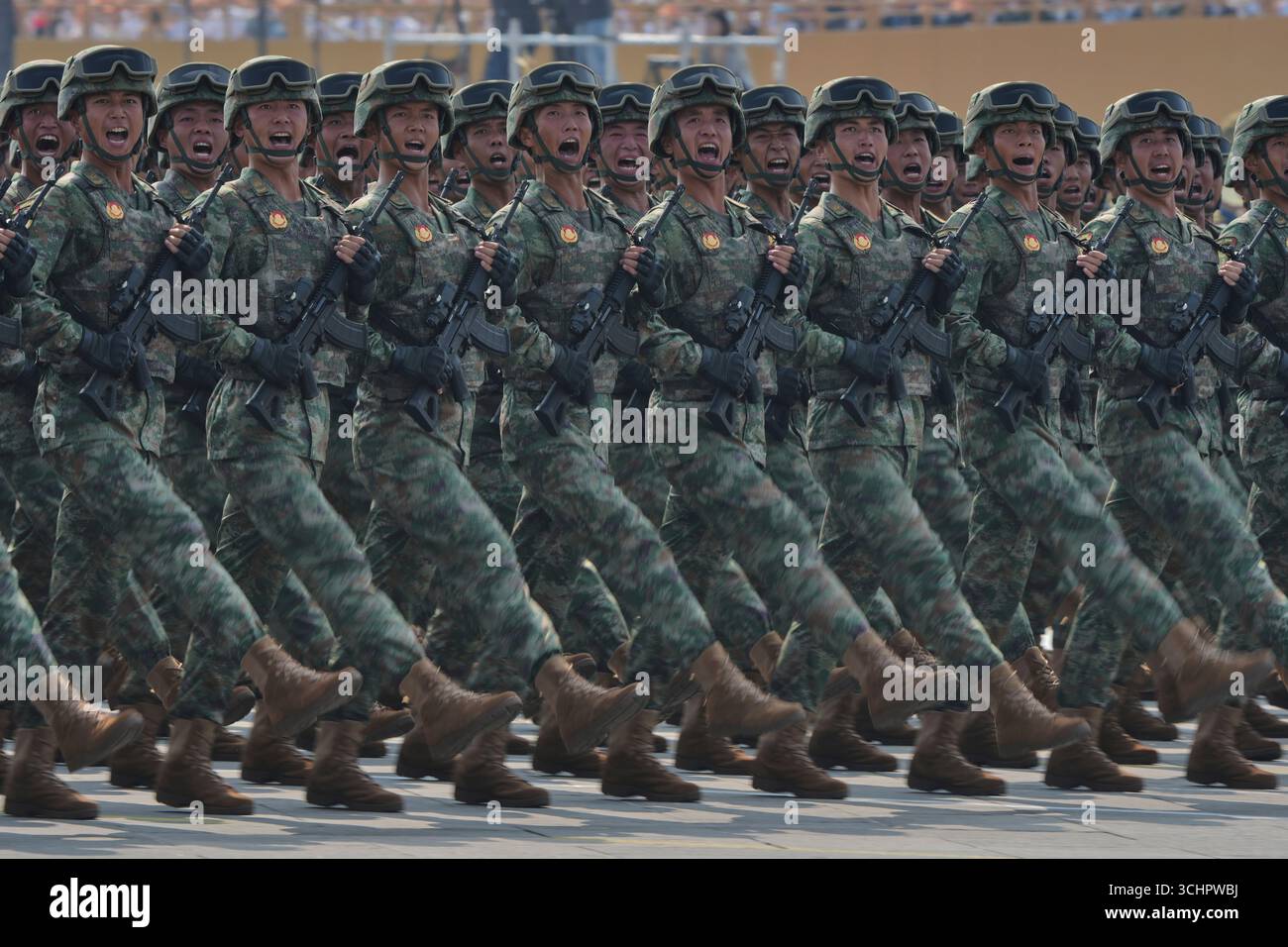 Military personnel shout as they take part in a military parade to ...
