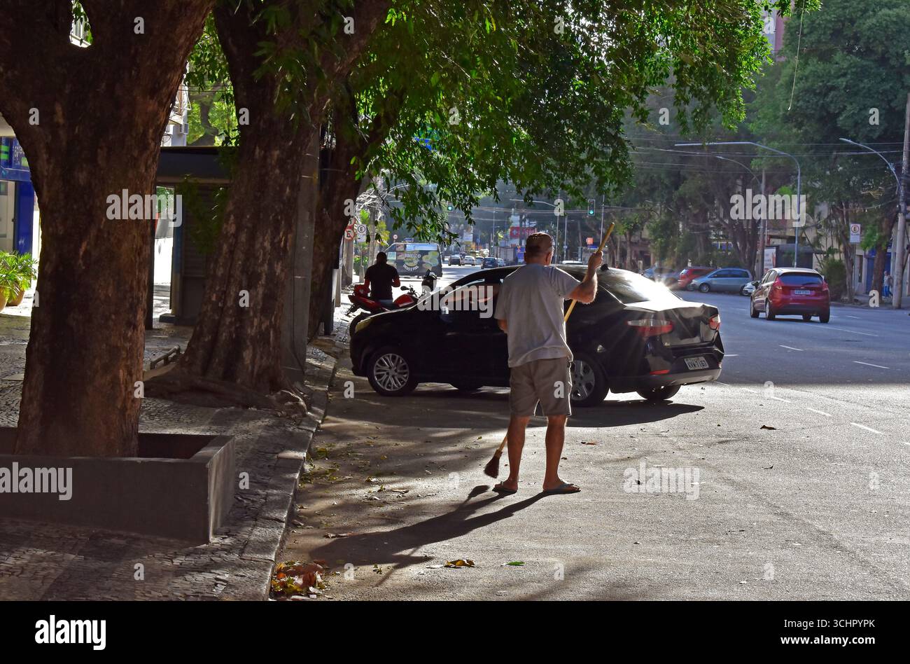 RIO DE JANEIRO, BRAZIL - August 23, 2025: Man sweeping the street in ...