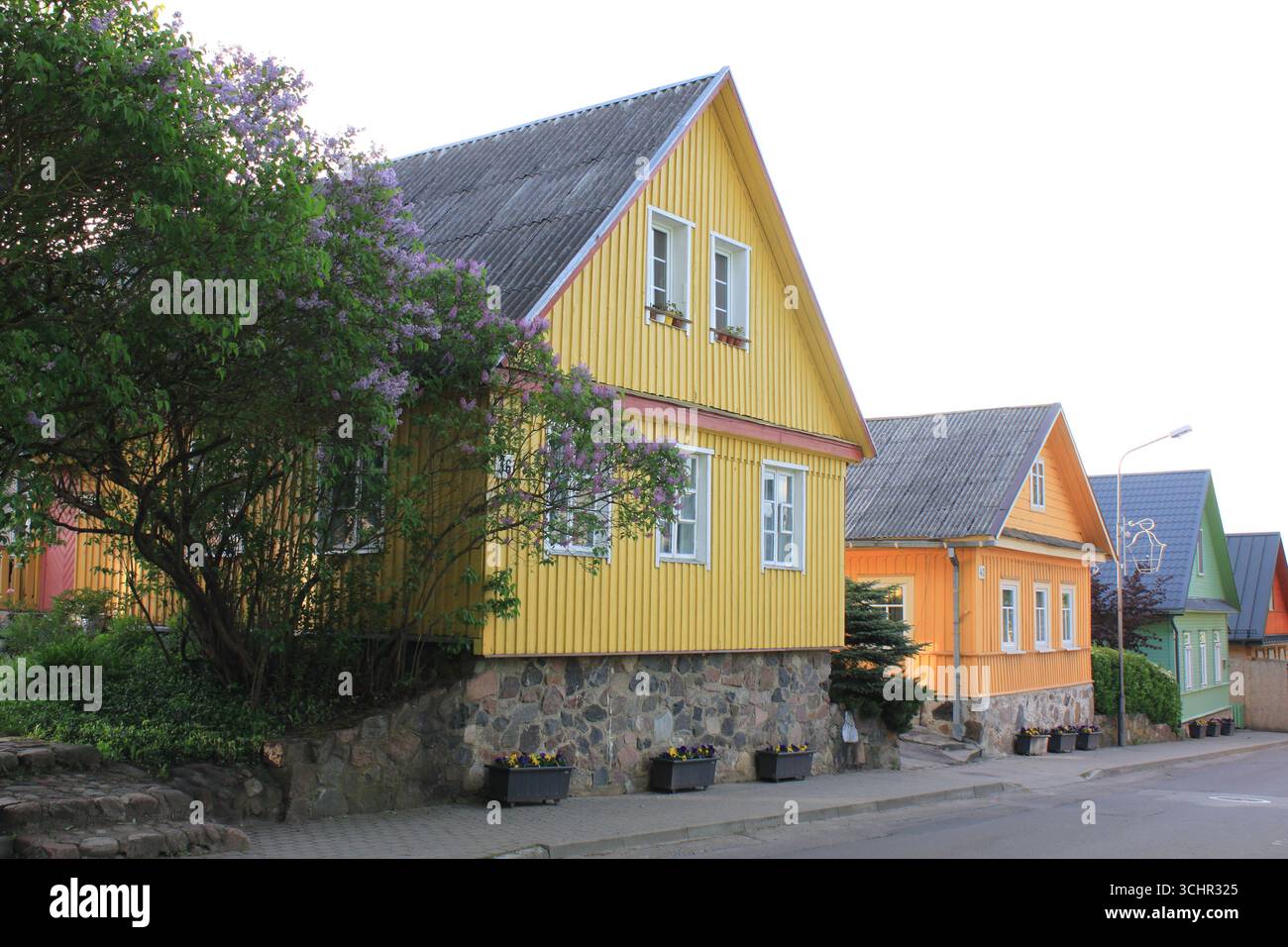 Colorful historic homes along narrow hi-res stock photography and ...