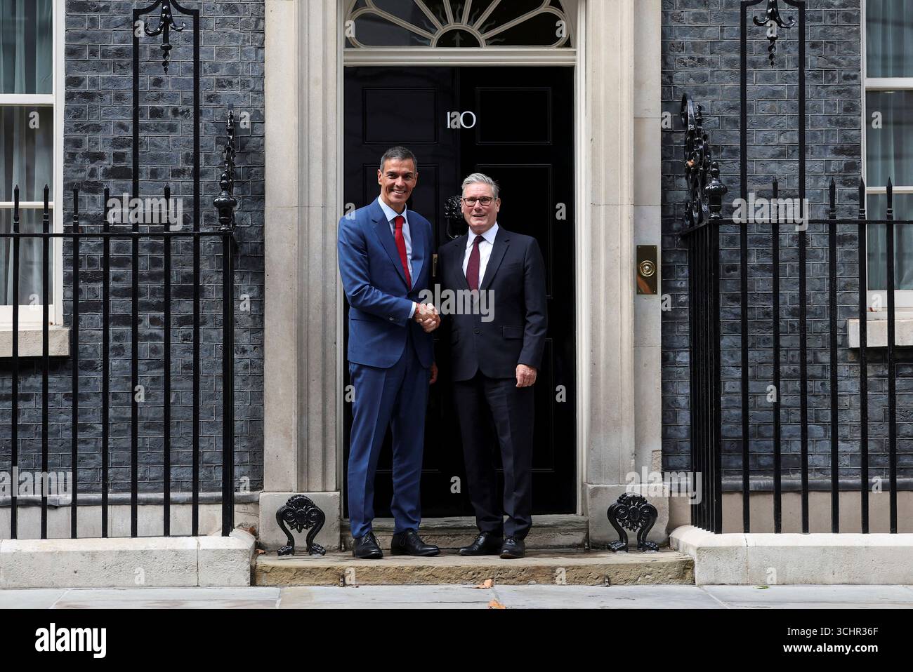 British Prime Minister Keir Starmer, right, welcomes Spanish Prime ...