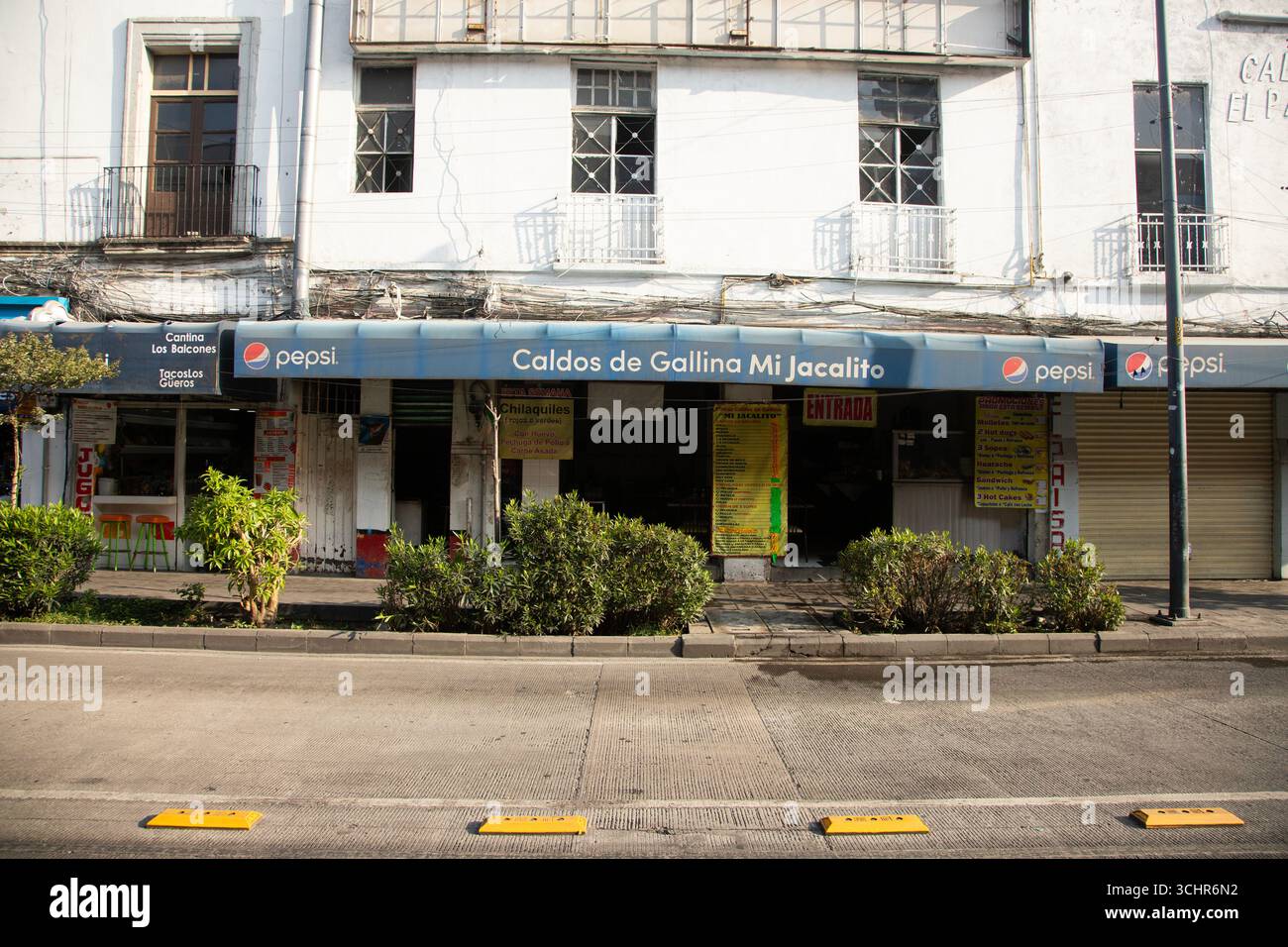 Mexico City, Mexico; November 1, 2025: Street-level restaurants and ...
